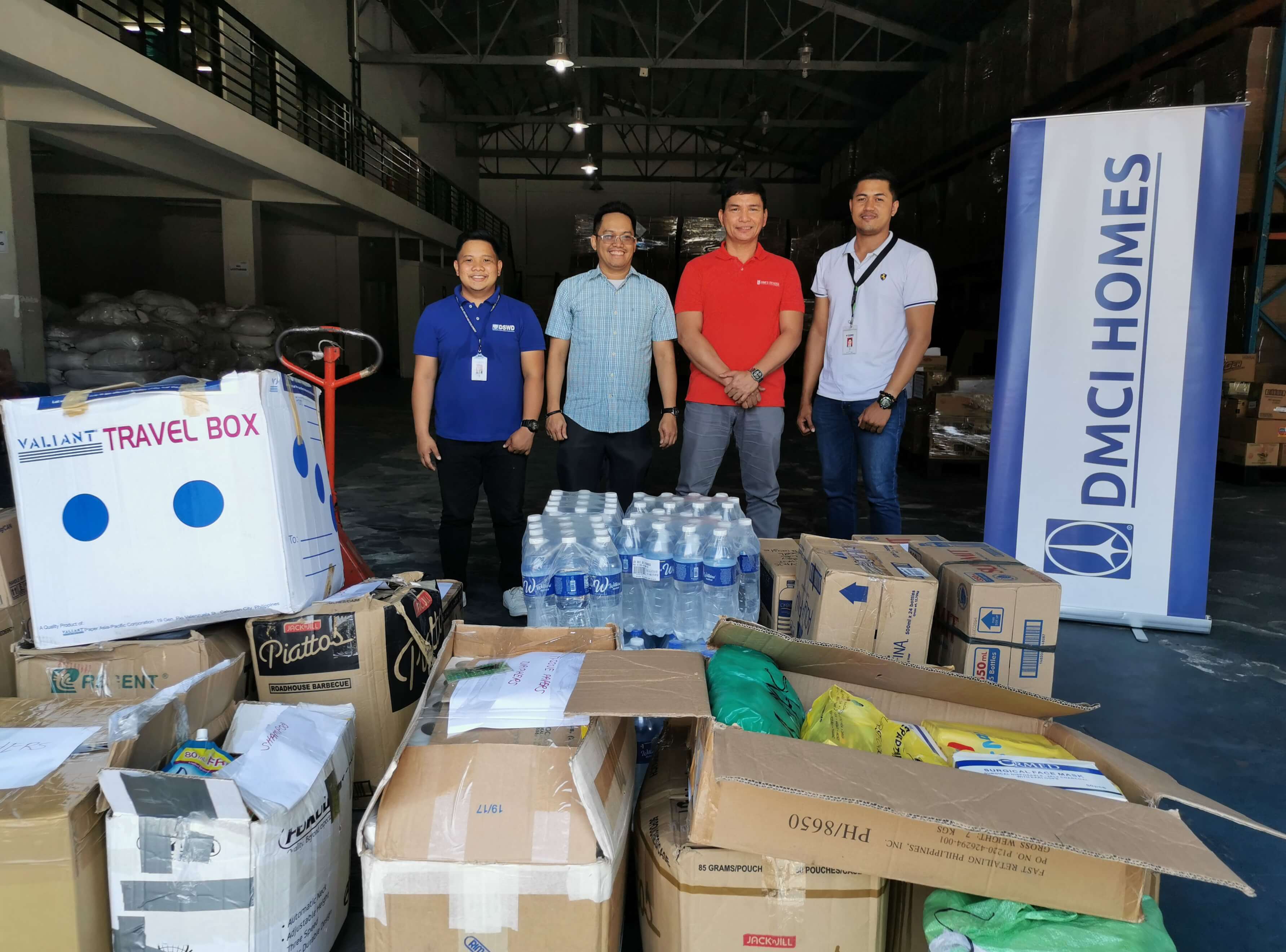 DMCI Homes employees, condo residents donate goods for Taal