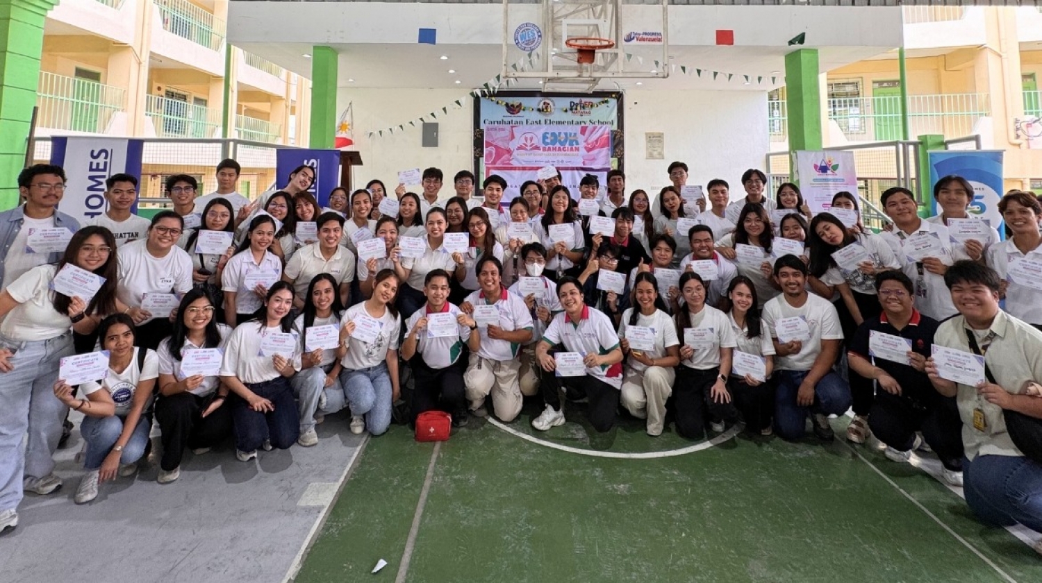 DMCI Homes employees volunteer for community education initiative